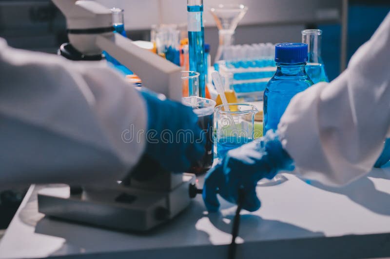 Scientist Pipetting Medical Samples into Microplate in Laboratory Stock ...