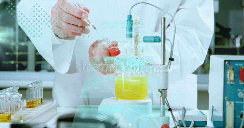 Scientist Pipetting Red Solution from Vial into Beaker at Bench, with ...