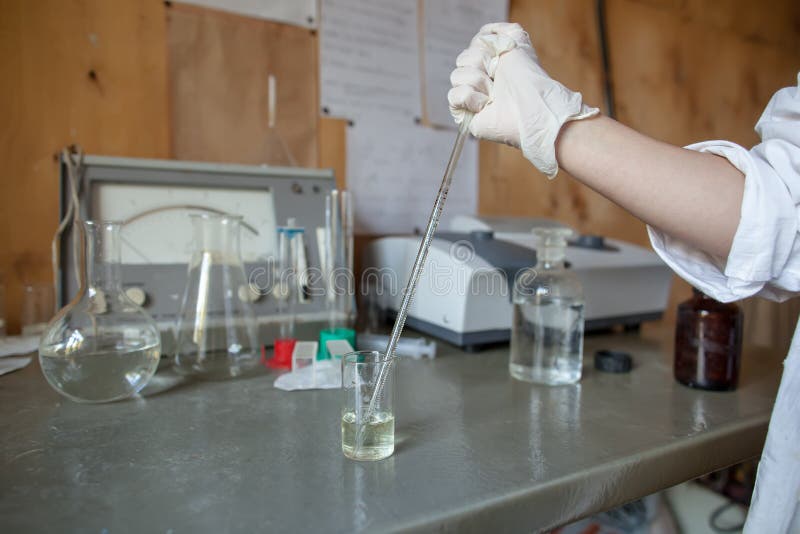 Scientist Pouring Liquid with a Pipette into a Test Tube Stock Image ...