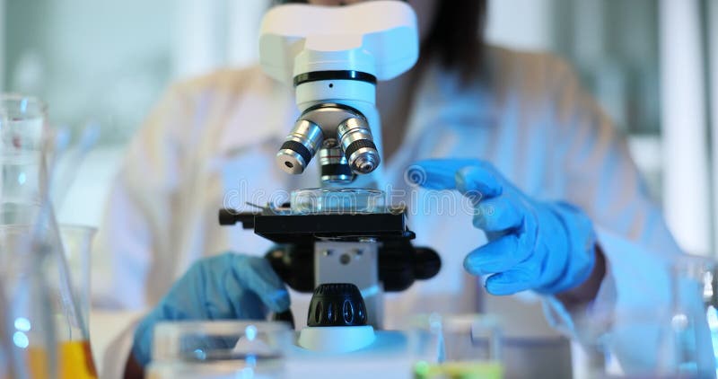 Scientist Prepares Sample for Analysis Using Microscope Stock Video ...