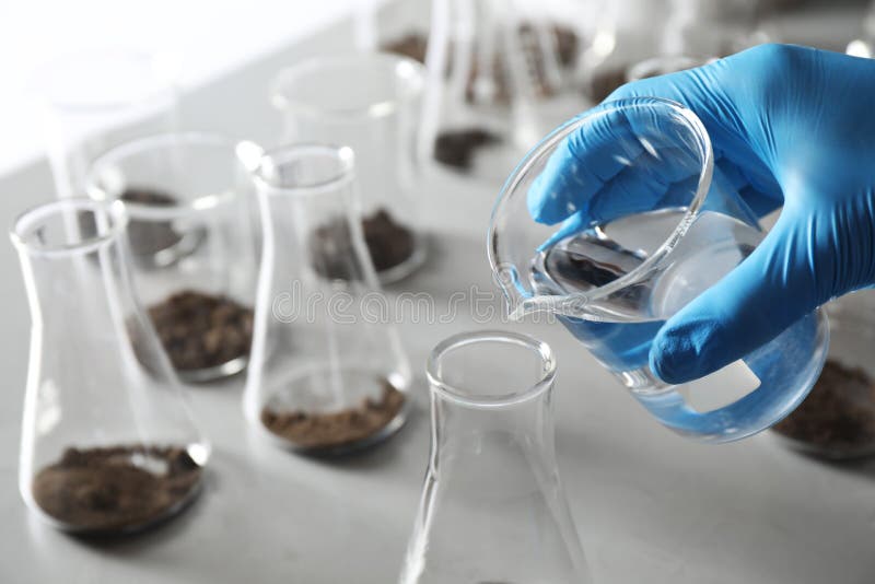 Scientist Preparing Soil Extract at Table. Laboratory Analysis Stock ...