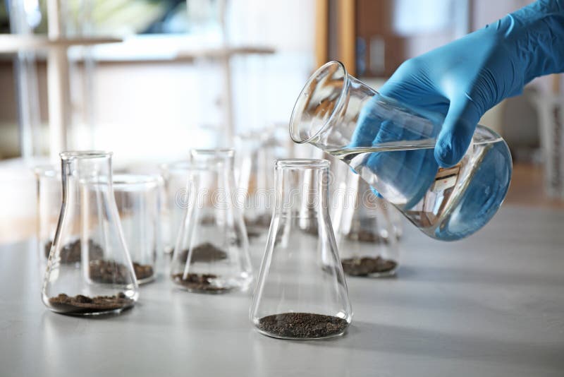Scientist Preparing Soil Extract at Table. Laboratory Analysis Stock ...