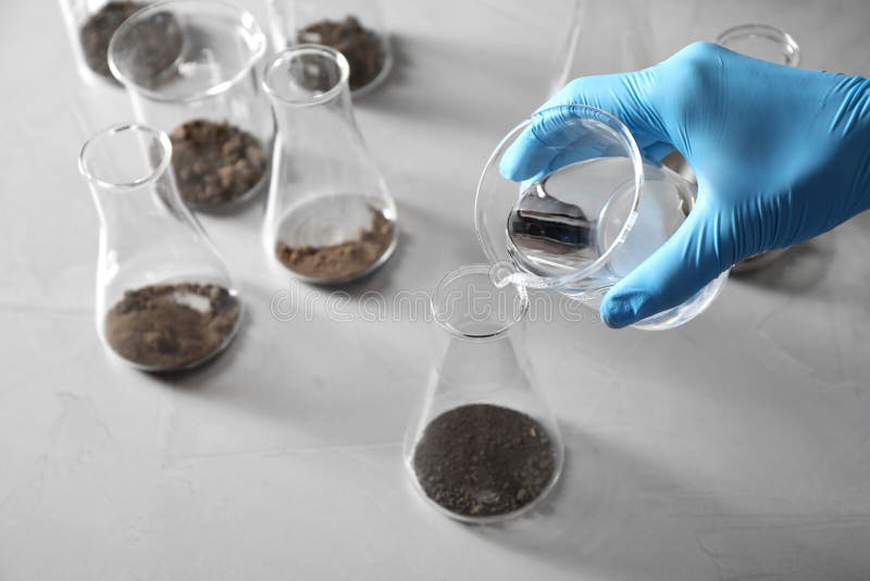 Scientist Preparing Soil Extract at Table. Laboratory Analysis Stock ...