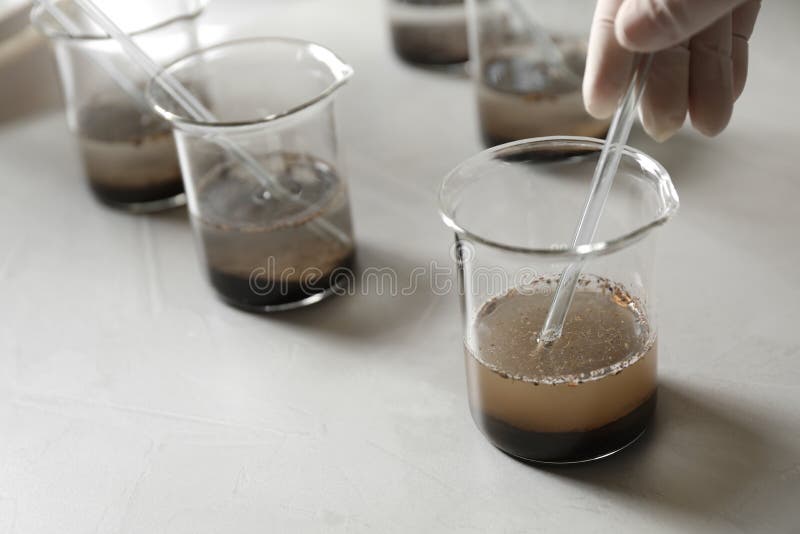 Beaker with Soil Extract on Light Table. Laboratory Analysis Stock ...