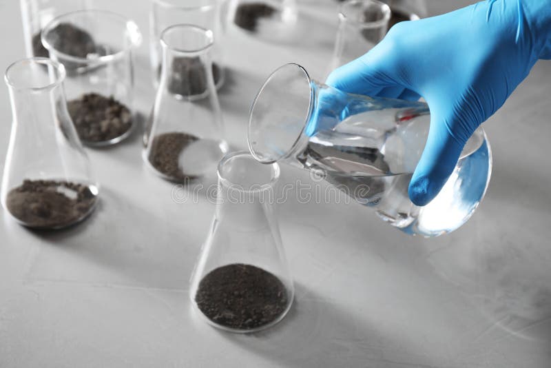 Scientist Preparing Soil Extract at Table. Laboratory Analysis Stock ...