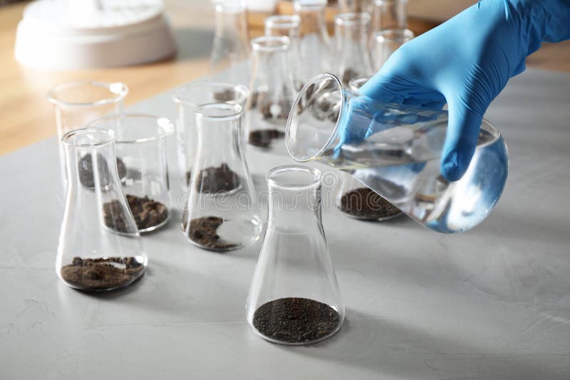 Scientist Preparing Soil Extract at Table. Laboratory Research Stock ...