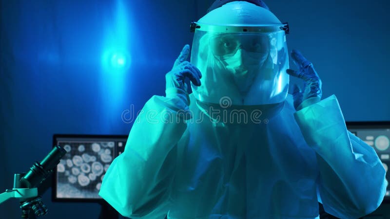 Scientist in Protection Suit and Masks Working in Research Lab Using ...