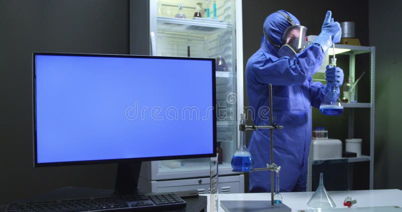 Scientist with Protective Suit and Blue Screen Stock Photo - Image of ...