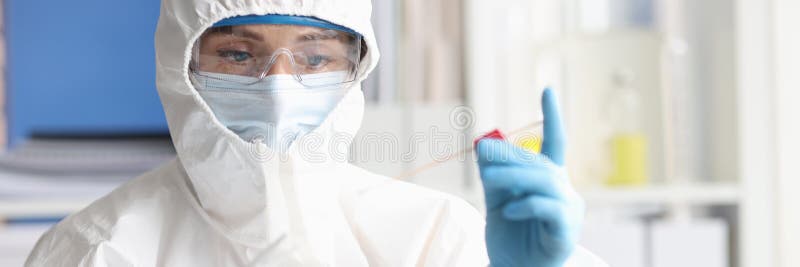 Scientist in Protective Suit and Goggles Conducts Research in ...