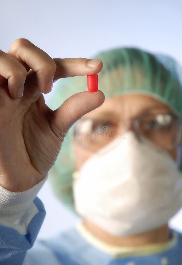 Scientist with red pill stock photo. Image of medical - 40348330