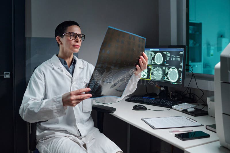 Scientist Reviewing X-Ray Image in Laboratory Stock Photo - Image of ...