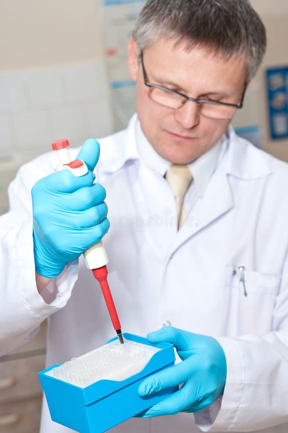 Scientist running a test stock photo. Image of working - 14016136