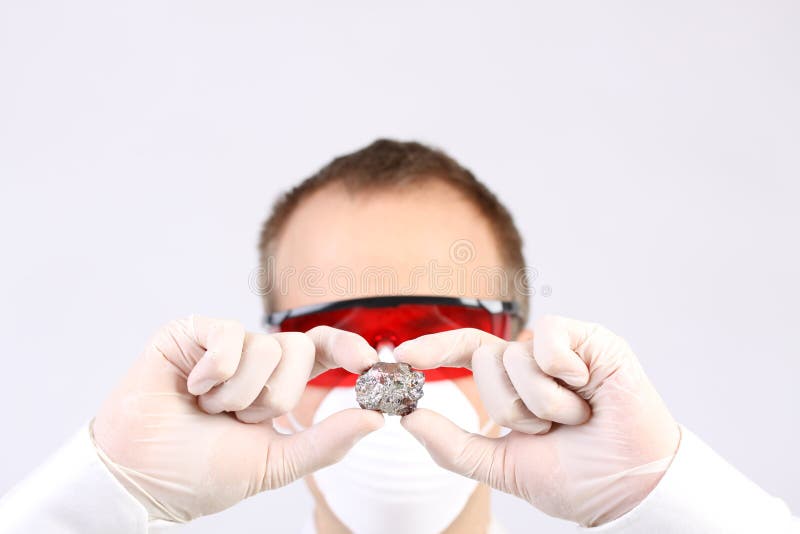 Scientist with a Sample of Metal Stock Photo - Image of person, face ...
