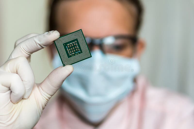 Scientist Showing the Computer Microchip before Repairs Electron Stock ...