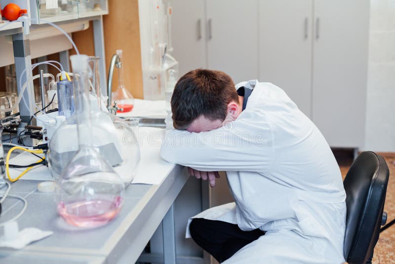 Scientist Sleeps in the Workplace in a Chemical Lab Stock Image - Image ...