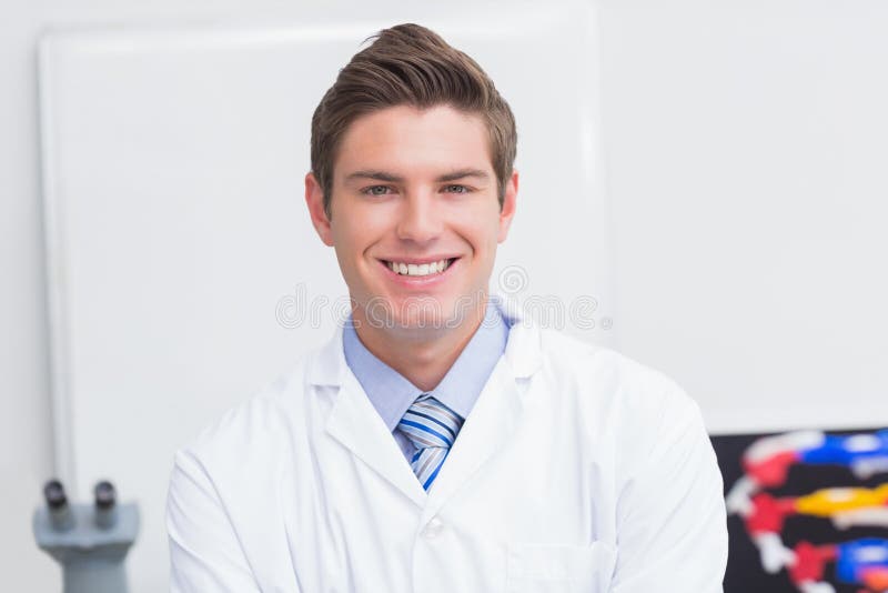 Scientist Smiling at Camera Stock Image - Image of coat, indoors: 53056503