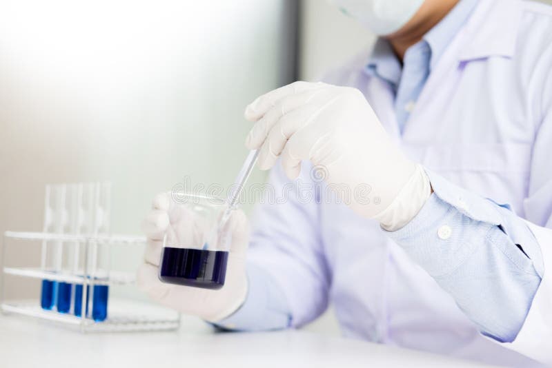 Scientist Stirs Reagents Beaker in Science Laboratory. Stock Image ...