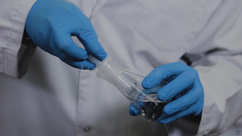 Scientist with a Syringe Conducts Experiments. Stock Footage - Video of ...
