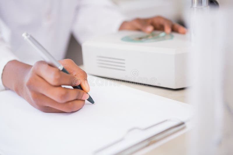 Scientist taking notes stock image. Image of chemistry - 53088265