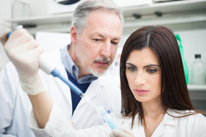 Scientist Taking a Sample from a Test Tube Stock Image - Image of ...