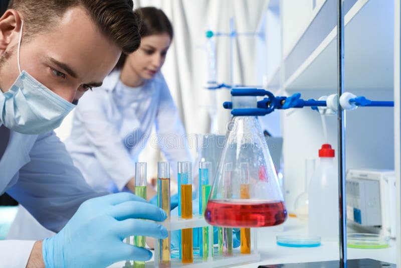 Scientist Taking Test Tube from Rack. Laboratory Analysis Stock Photo ...