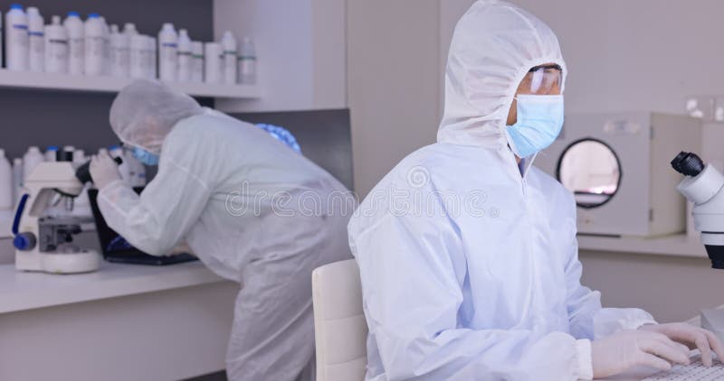 Scientist Team in Laboratory, PPE and Typing at Computer, Science Study ...