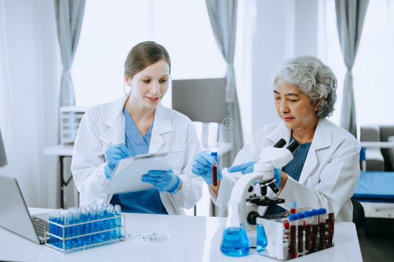 Scientist Team Meeting and Writing Analysis Results in the Laboratory ...