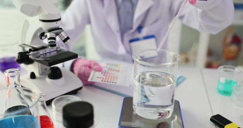 Scientist and Test Strip with Indicators of Different Colors for Liquid ...