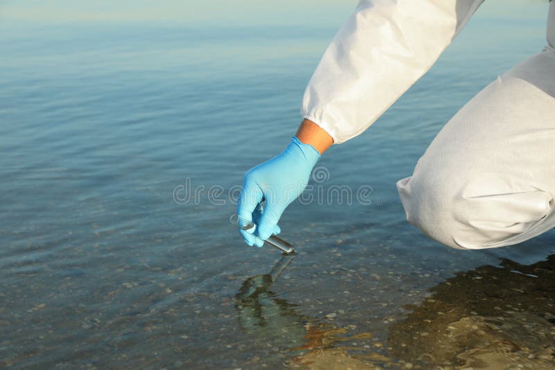 Scientist with Test Tube Taking Sample from River for Analysis, Closeup ...