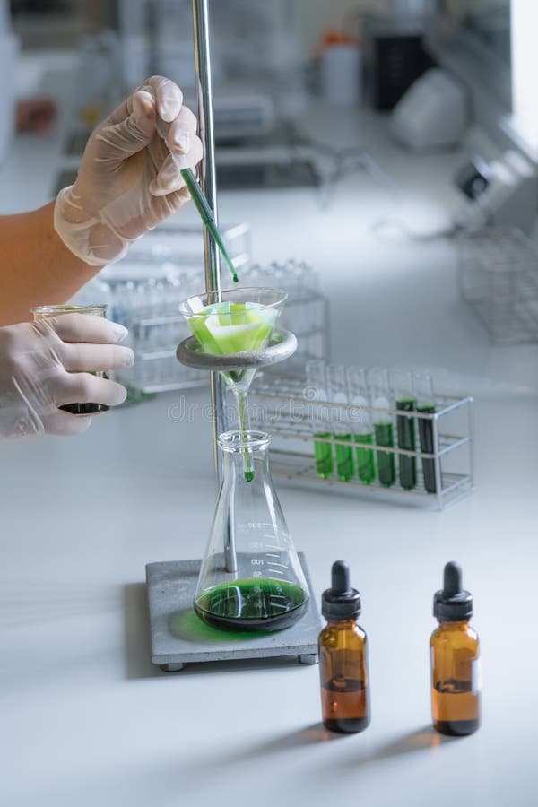 The Scientist is Testing the Natural Product Extraction and Green Color ...