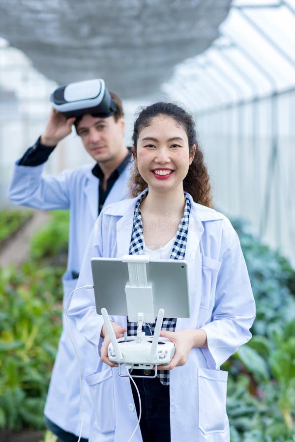 Scientist Use Remote Controller Piloting Drone at Vegetable Garden Lab ...