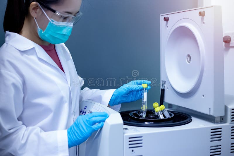 Hand of the Scientist Pick Up the Vial of Sample Solution To Analyze by ...