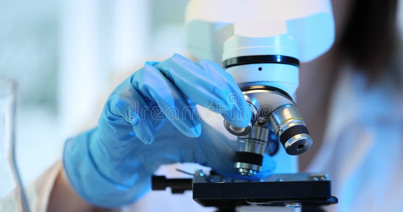 Scientist Uses a Microscope To Examine Sample Stock Footage - Video of ...