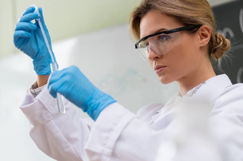 Scientist is Using Dropper and Test Tube in a Laboratory during ...