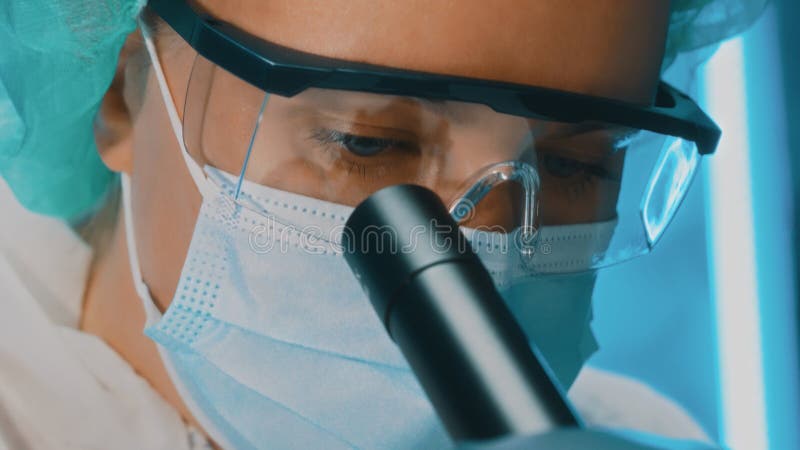 Scientist using microscope stock image. Image of analysis - 263352605
