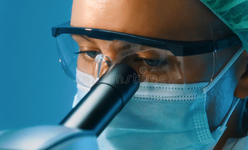Scientist using microscope stock photo. Image of engineer - 263352622