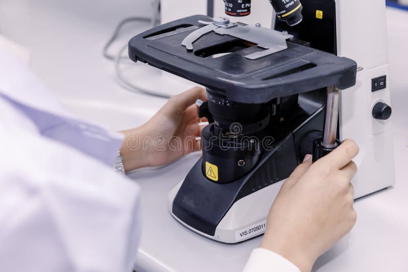 Scientist Using a Microscope in a Laboratory. Stock Photo - Image of ...
