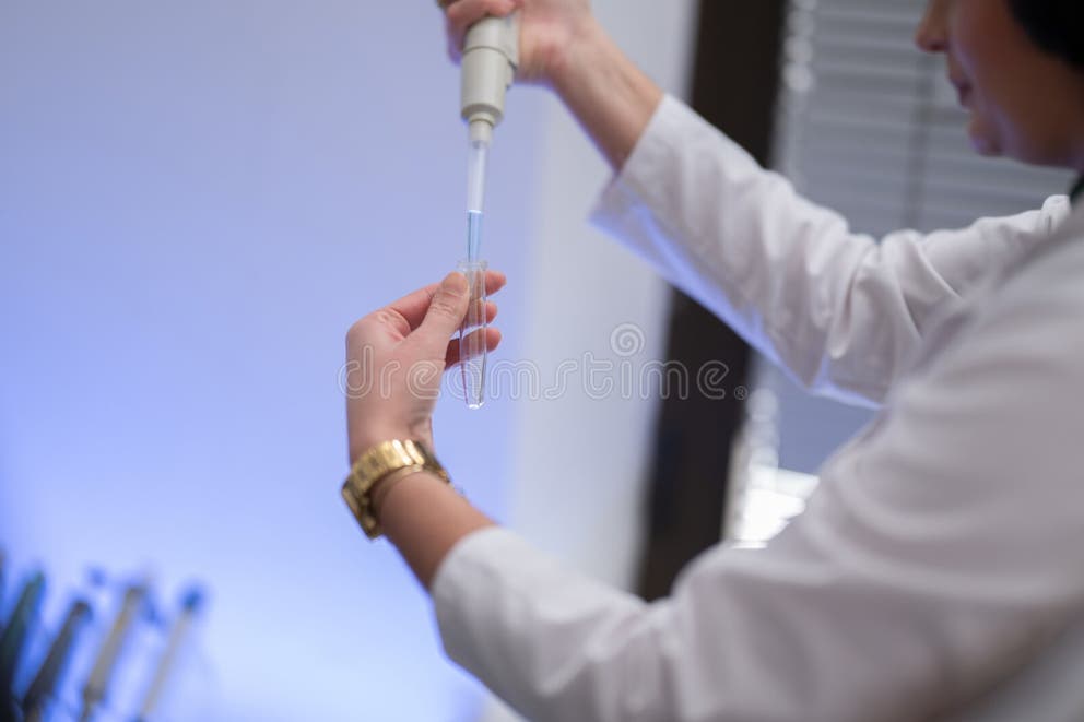 Scientist Using Pipette in Laboratory Experiment Stock Image - Image of ...