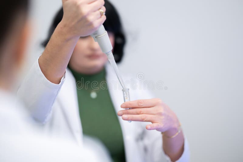 Scientist Using Pipette in Laboratory Experiment Stock Image - Image of ...