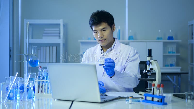 Scientist Using Video Conference with Colleagues Consulting about ...