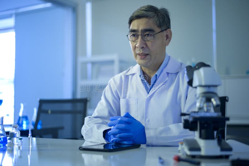 Scientist Using Video Conference with Colleagues Consulting about ...