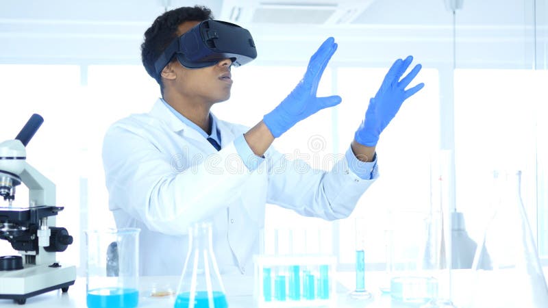 Scientist Using Virtual Reality Glasses for Research and Imagination in ...