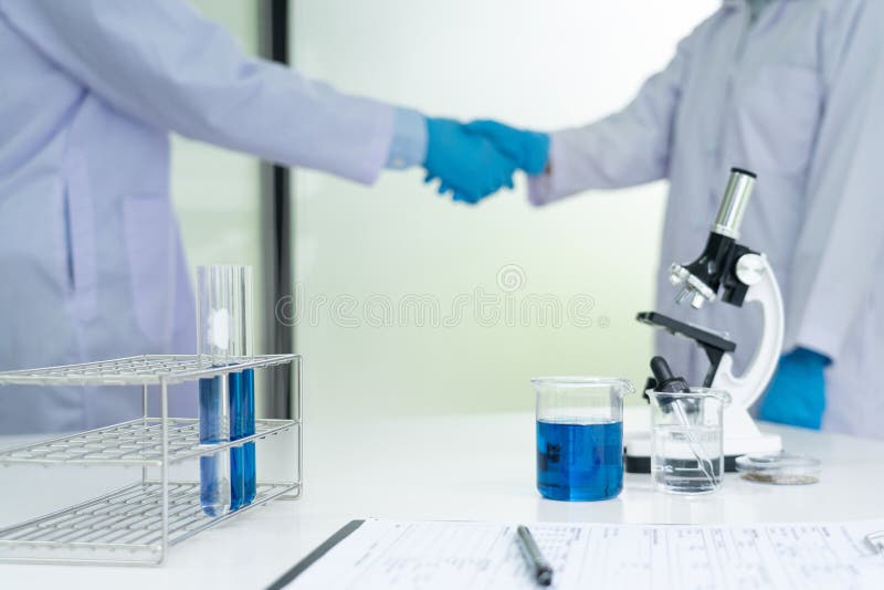 A Scientist Wearing Medical Isolation Gown Investigating the Growth ...