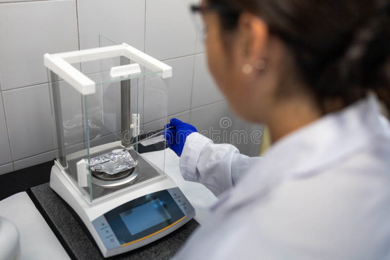 Scientist Weighing a Sample on a Scale Stock Image - Image of ...