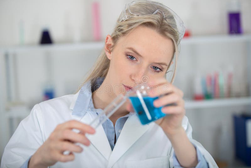 Scientist Woman in Lab Uniform Making Clinical Experiment Stock Image ...
