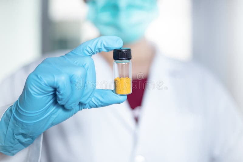 Scientist Woman Shows Orange Solid in Vial Glass of Curcumin Compound ...