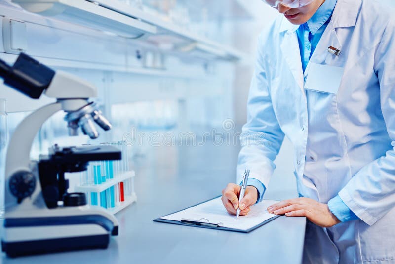 Scientist at work stock photo. Image of microscope, adult - 68772800