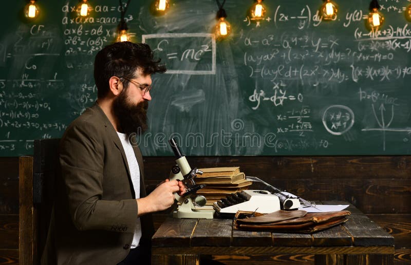 Scientist Work With Microscope. Man With Beard And Mustache In School ...