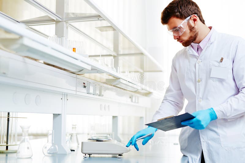 Scientist at work stock photo. Image of eyeglasses, uniform - 73034778