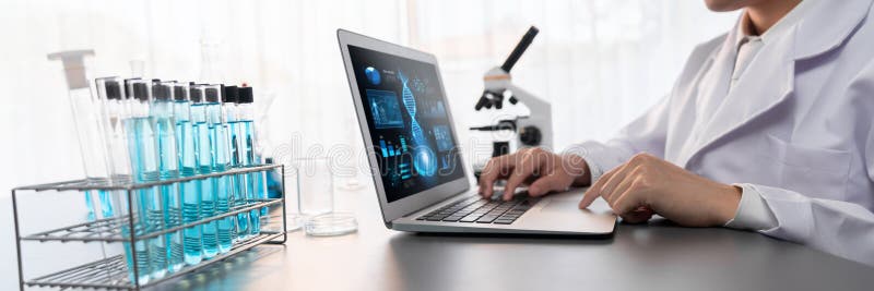 Scientist Conduct Chemical Experiments in Laboratory with Laptop ...